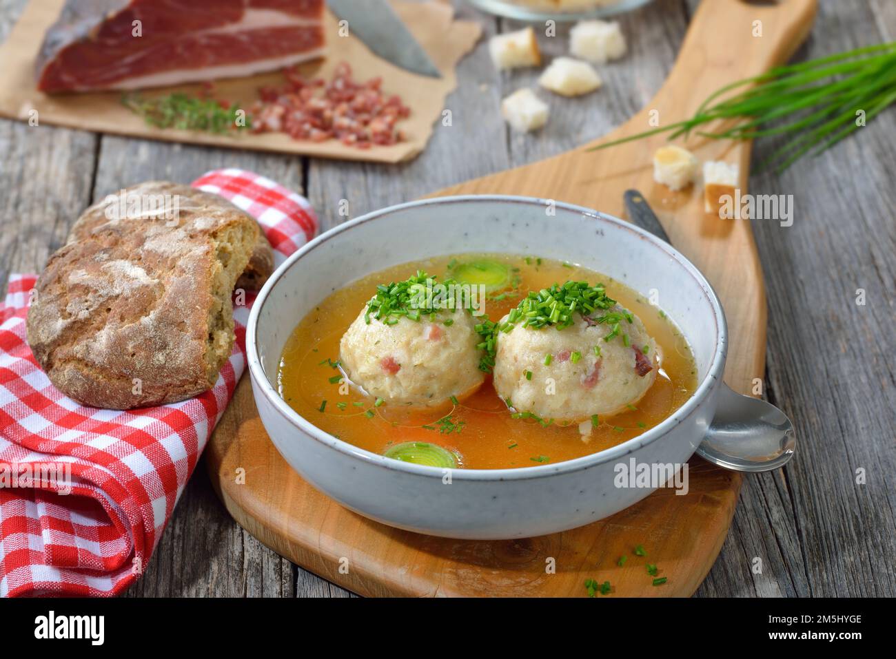 Delicious South Tyrolean bacon dumplings soup with hot beef broth and ...