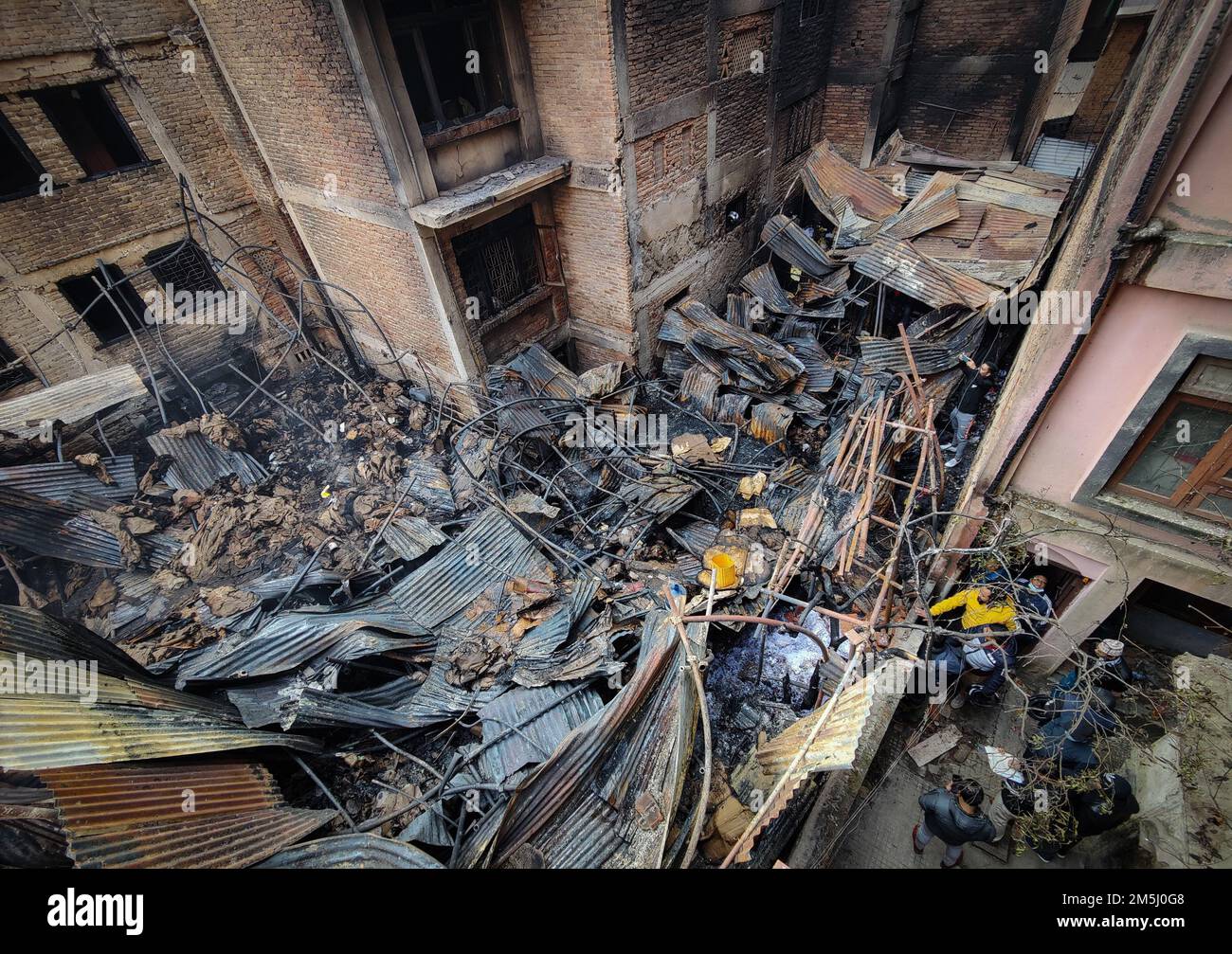 Kathmandu, Bagmati, Nepal. 29th Dec, 2022. People gather around the ...