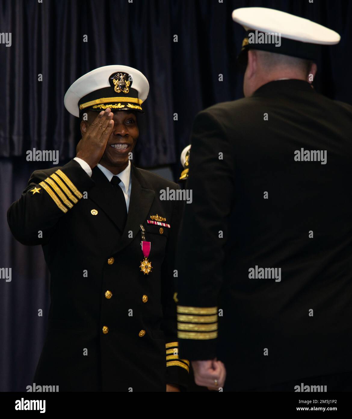 NEWPORT, R.I. (March 18, 2022) Capt. Alexis Walker (left), commanding ...