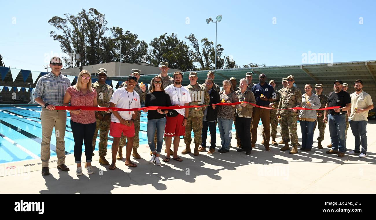 Vandenberg Space Force Base personnel pose for a photo at the ribbon ...
