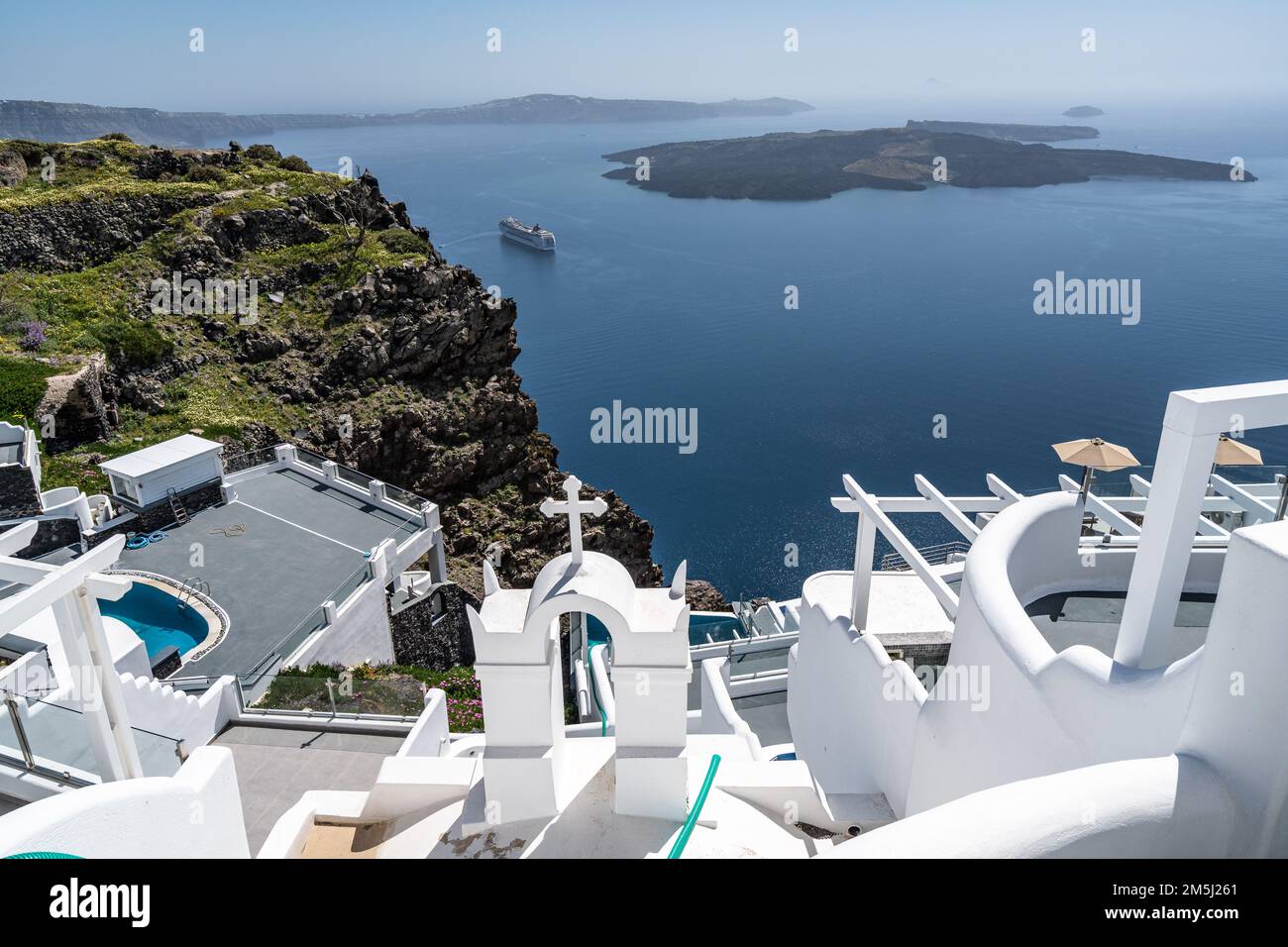 The typical white washed greek buildings in Santorini overseeing the ...
