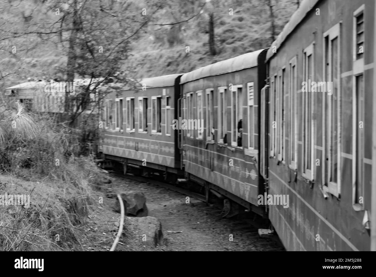 Toy Train moving on mountain slope, beautiful view, one side mountain ...