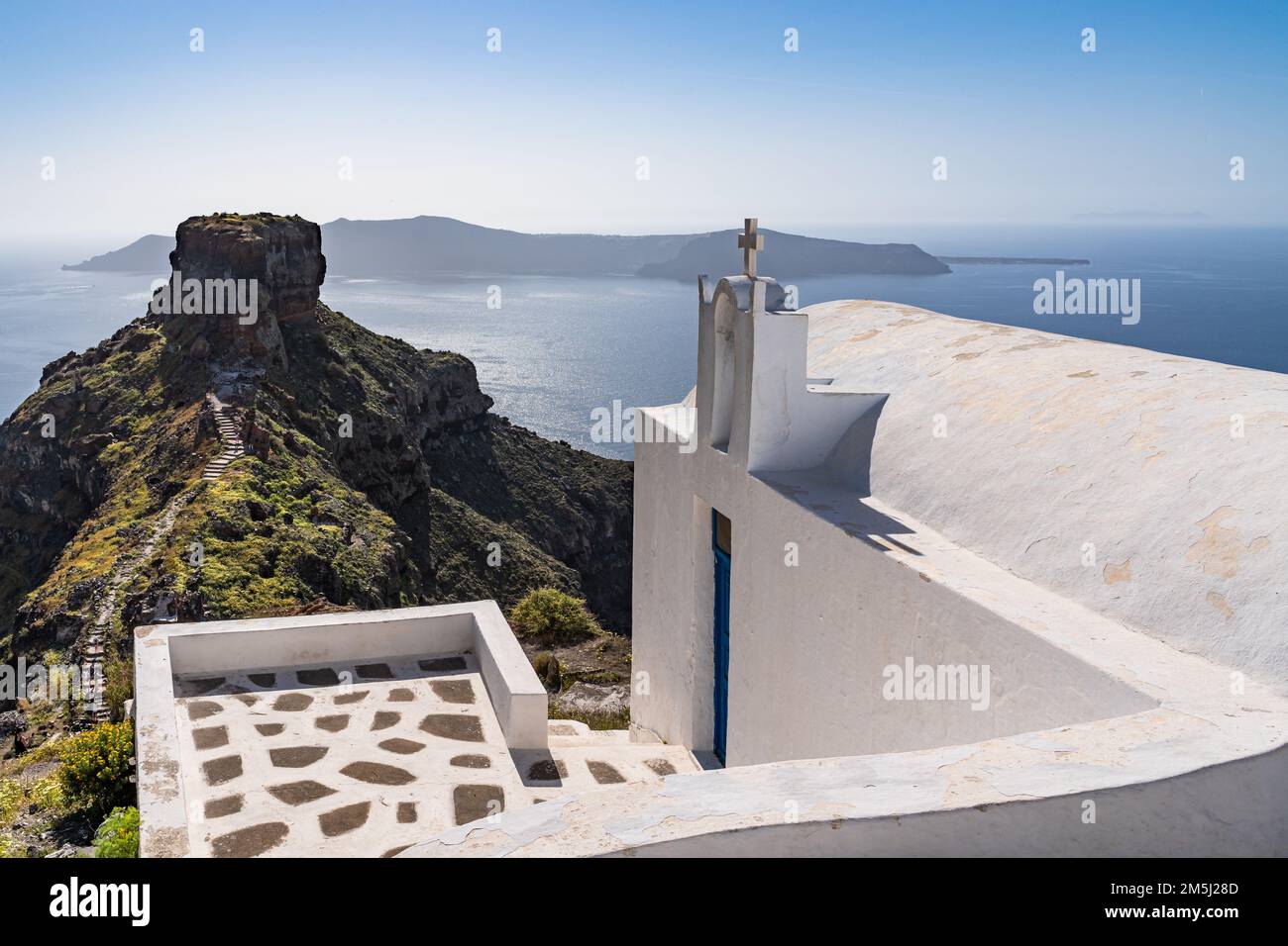 A traditional white Greek church with an amazing view over Sakros rock ...