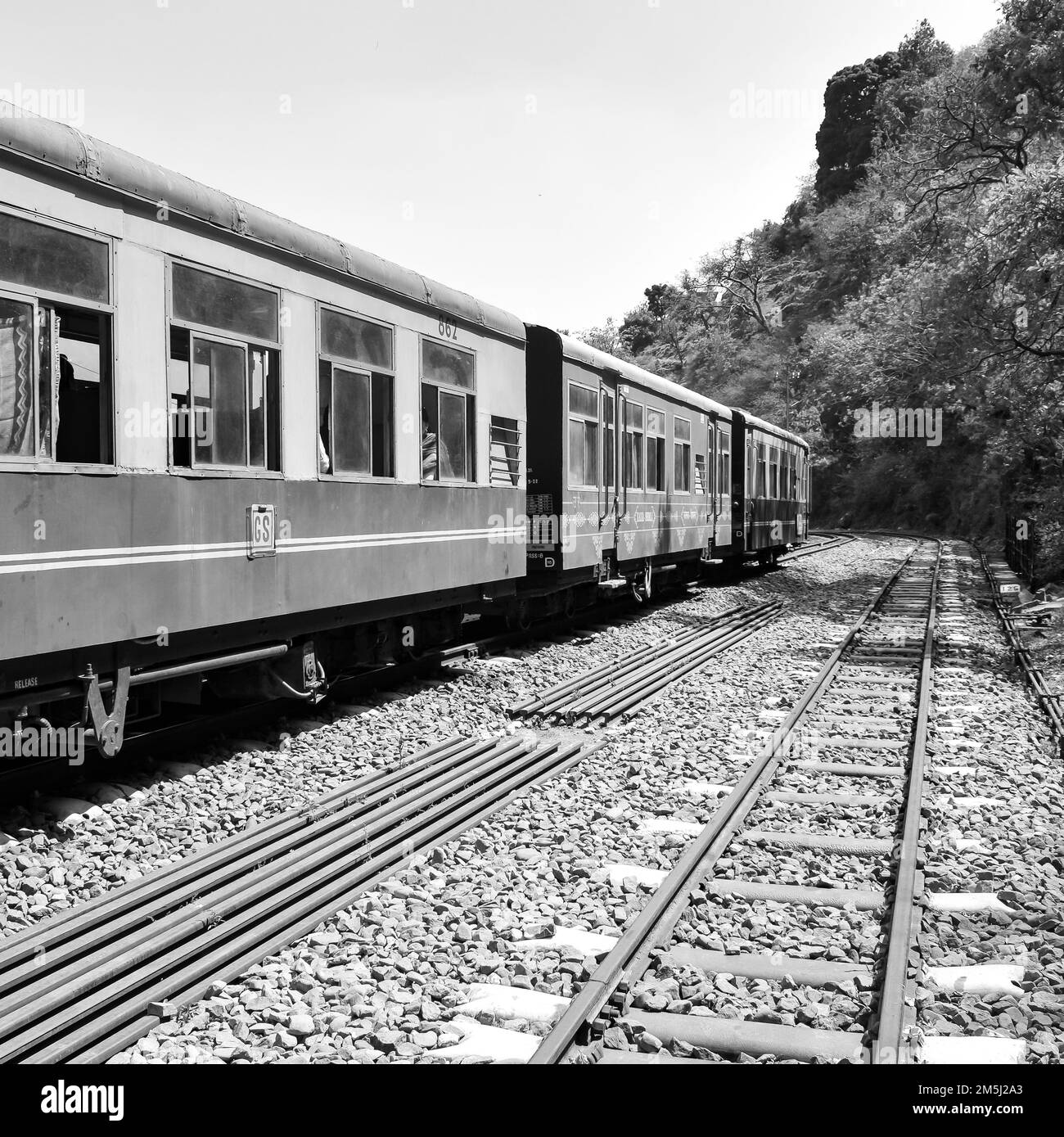 Toy Train moving on mountain slope, beautiful view, one side mountain ...