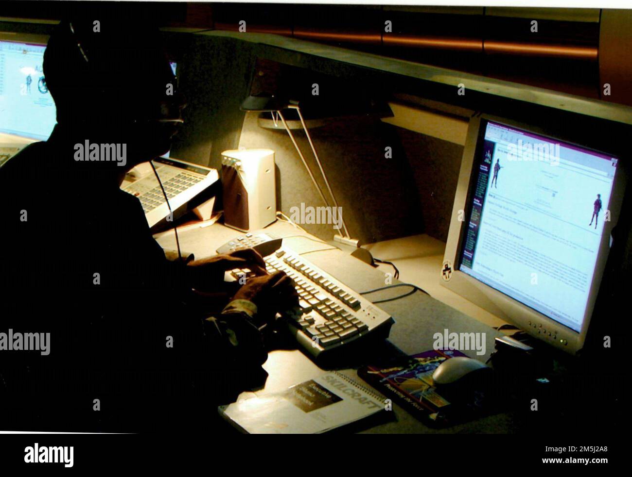 A Land Information Warfare Activity soldier works on a vulnerability ...