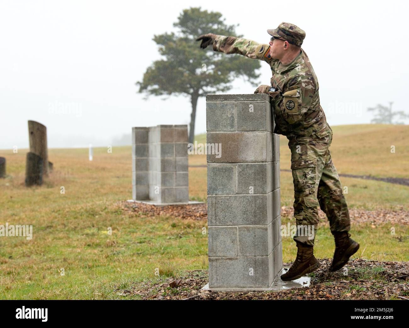 Oregon Army National Guard Soldier throws a training grenade toward a series of targets during ...
