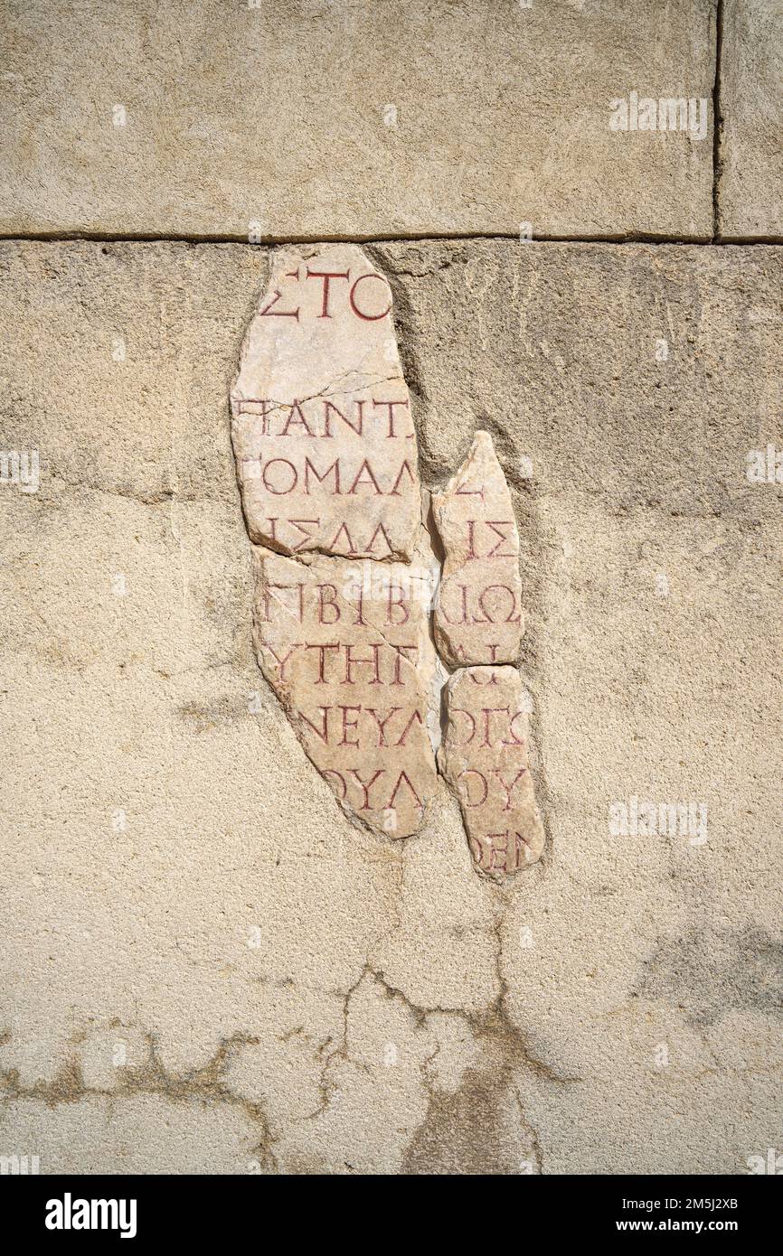 Fragment of an ancient Greek inscription carved in marble Stock Photo ...