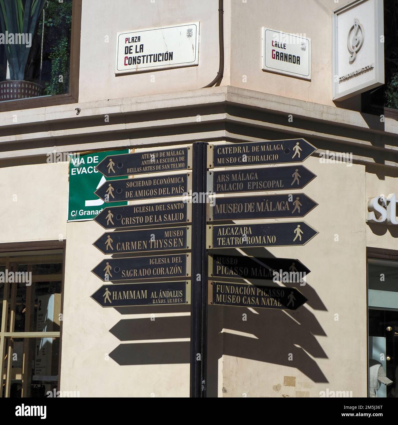 sign post to the many visitor attractions in the old city of Malaga ...