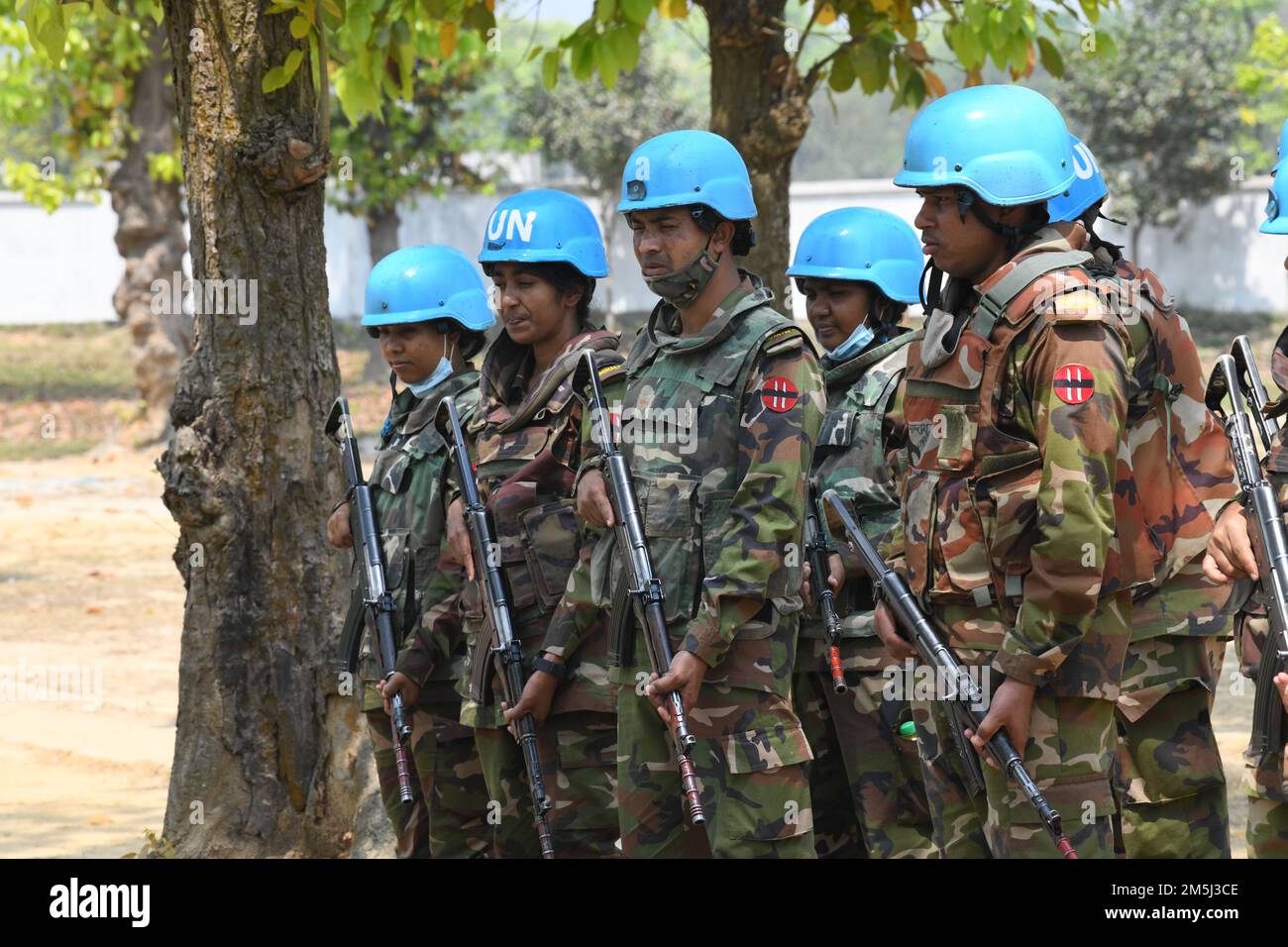 Bangladeshi Army soldiers observe their instructor during an improvised ...
