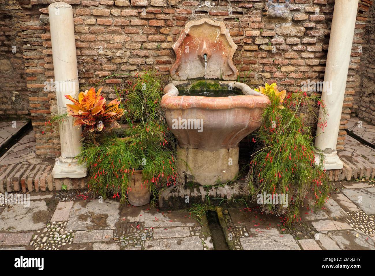 water feature,fountain between two repurposed roman columns in the ...