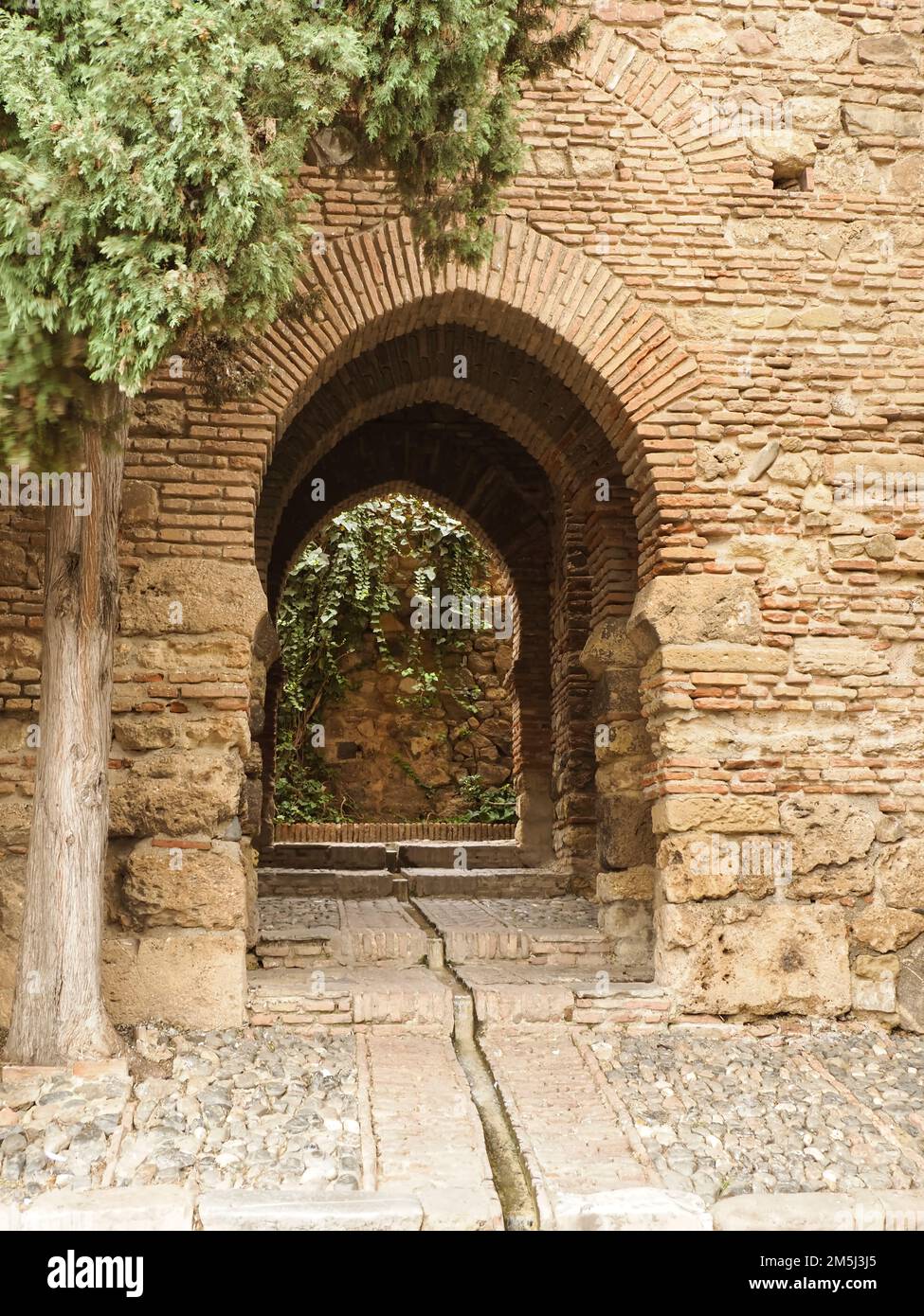 arch gateway through the wall of the Alcazaba,Malaga,Spain,Europe Stock ...