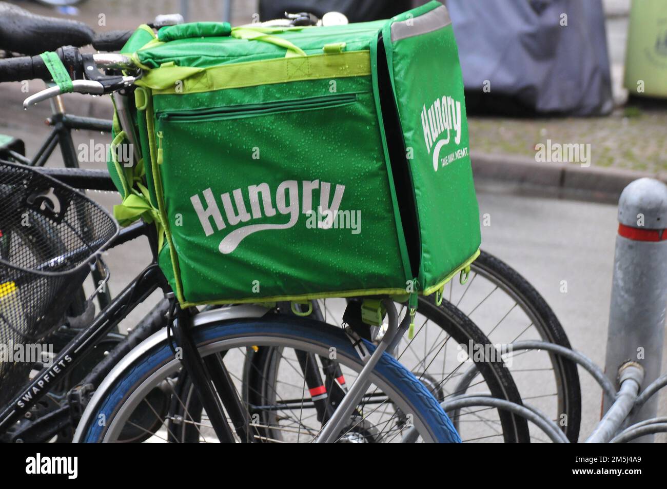 Copenhagen/Denmark/29 December 2022/ Hungry food delivery biker in ...
