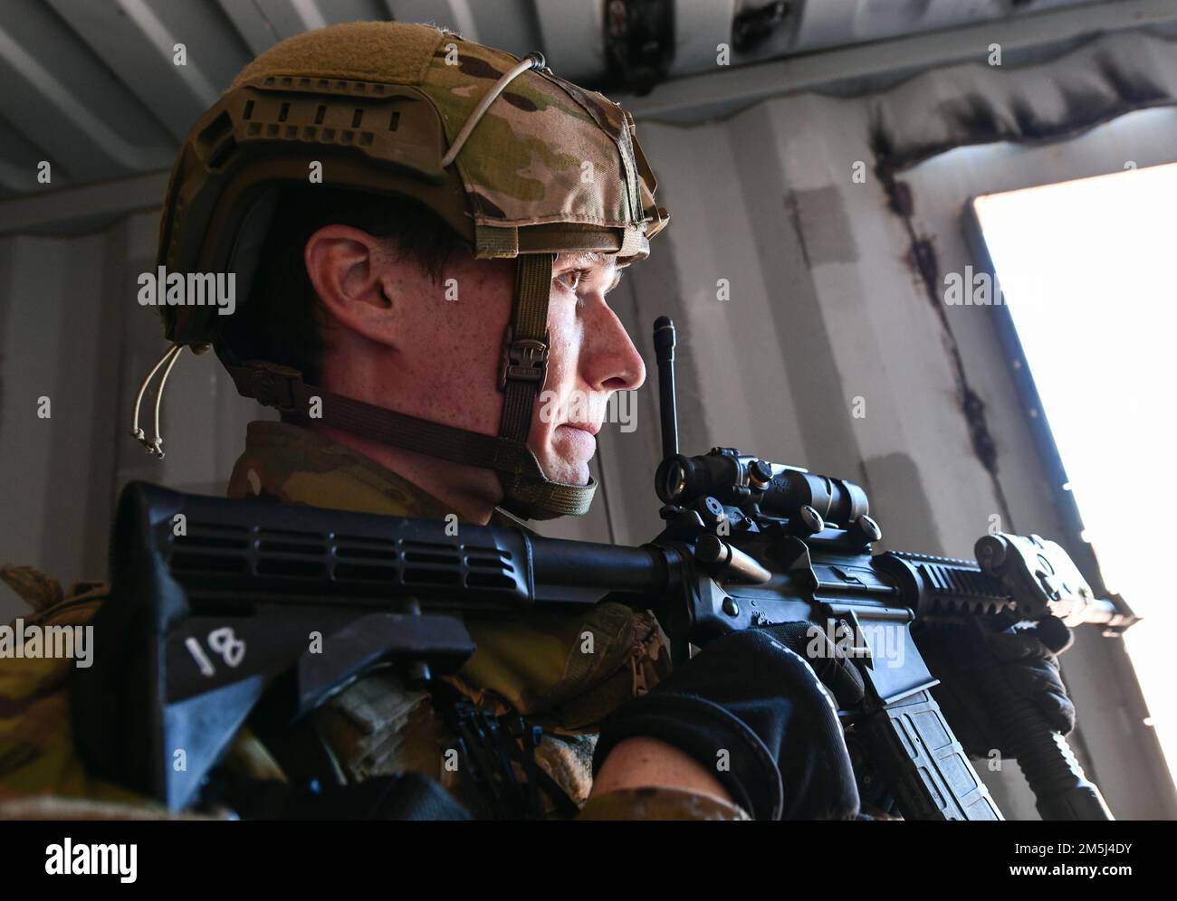 An Airmen stands lookout during a training scenario March 19, 2022 at ...