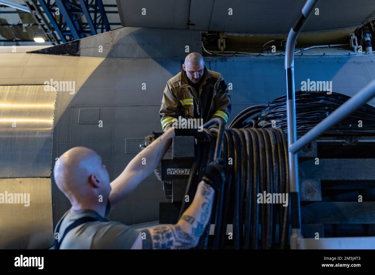 Estonia air force Senior Sgt. Tauri Mikki, firefighter, fills an airbag ...