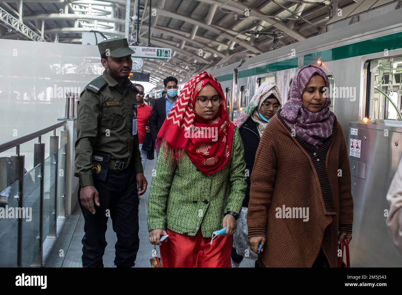 People in the metro rail station during the metro rail trip from Uttara ...