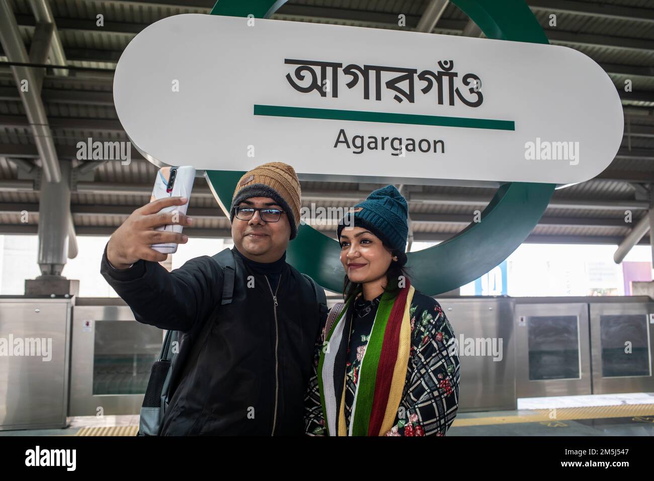 A couple takes a selfie during the ride at the metro rail trip from ...