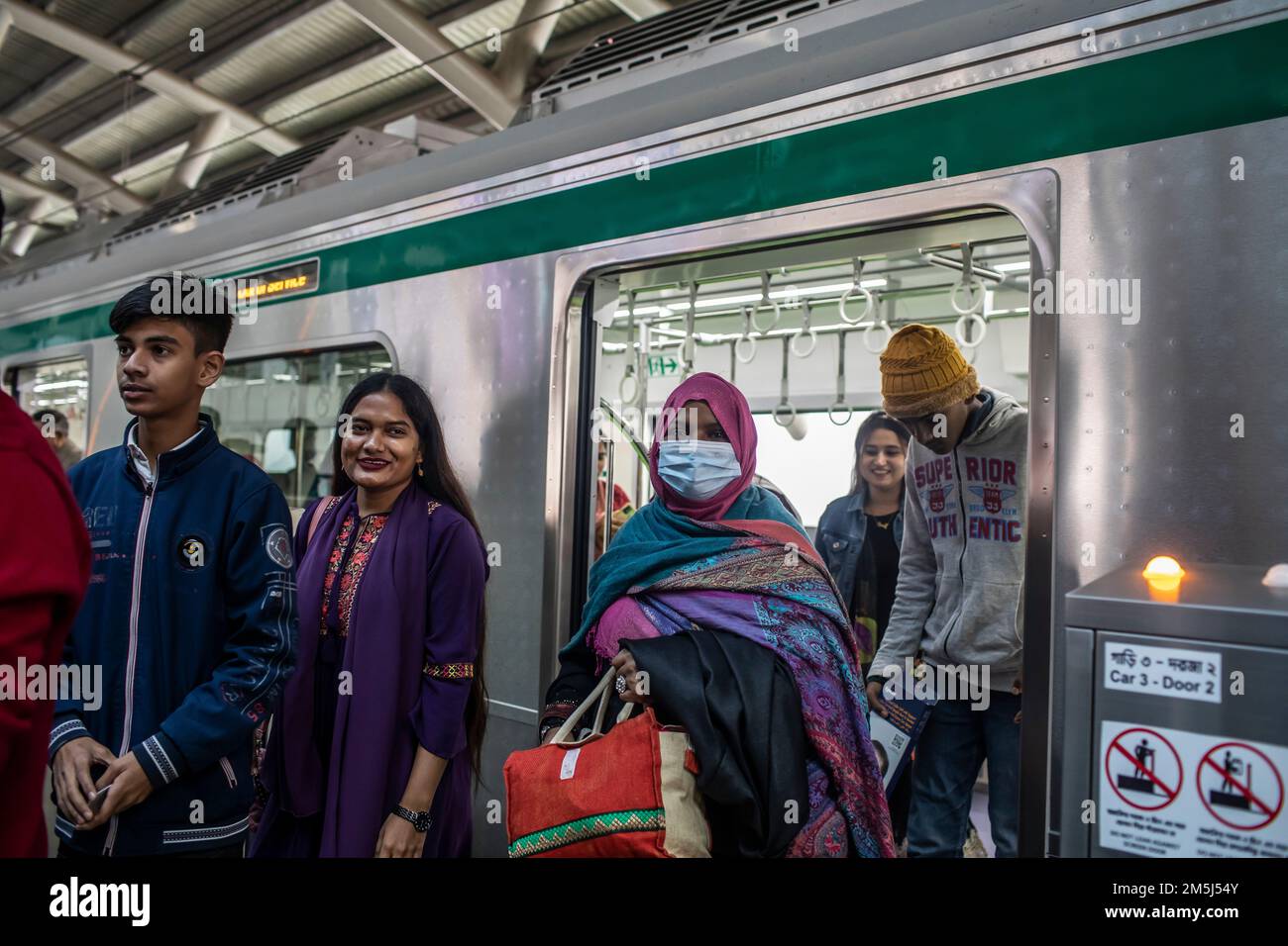 People in the metro rail station during the metro rail trip from Uttara ...