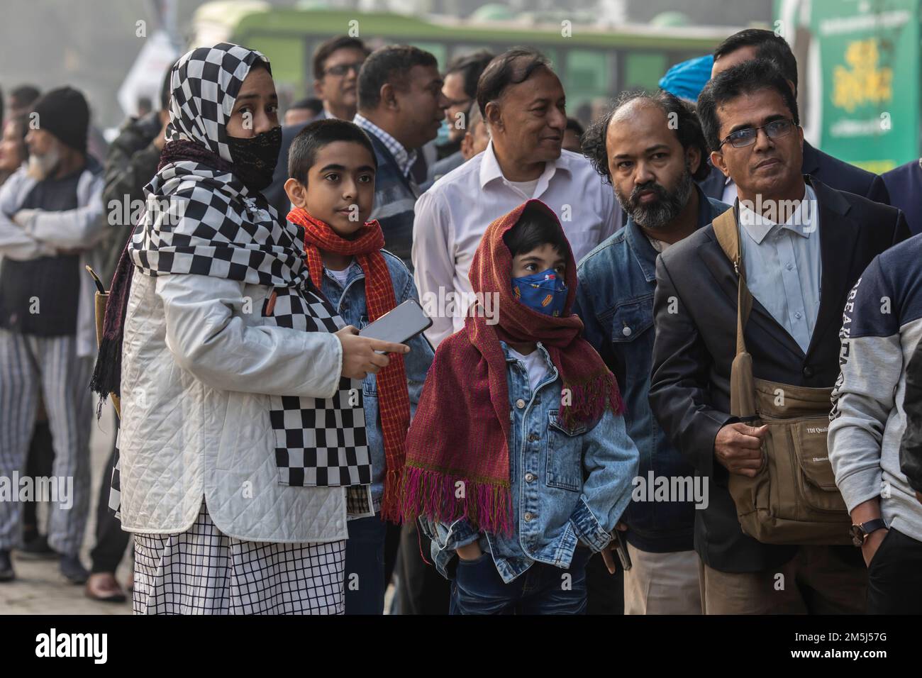 Commuters stand in queues to board a metro rail ride during the ride ...
