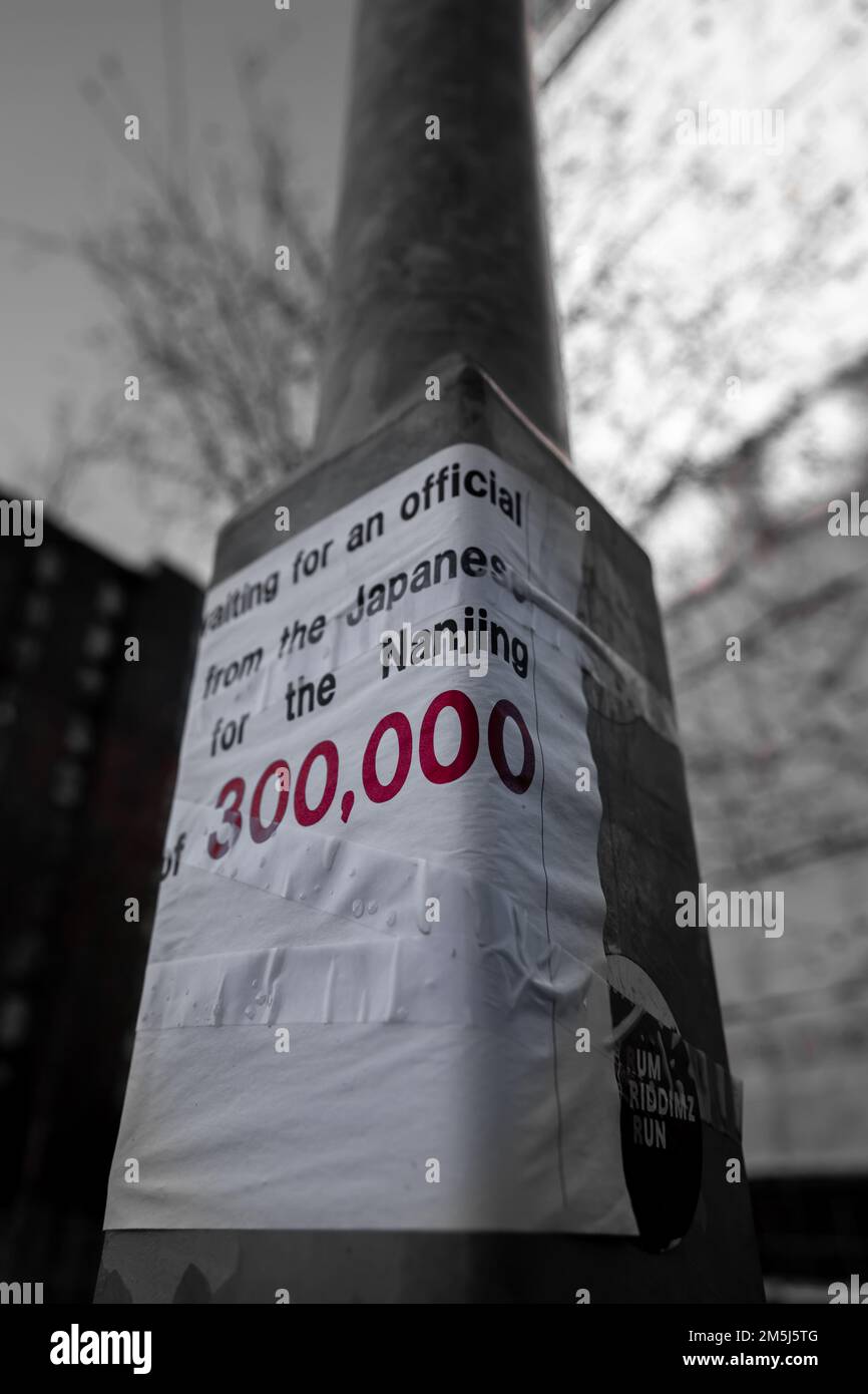 A poster about Nanjing Massacre on a telegraph pole in Manchester ...