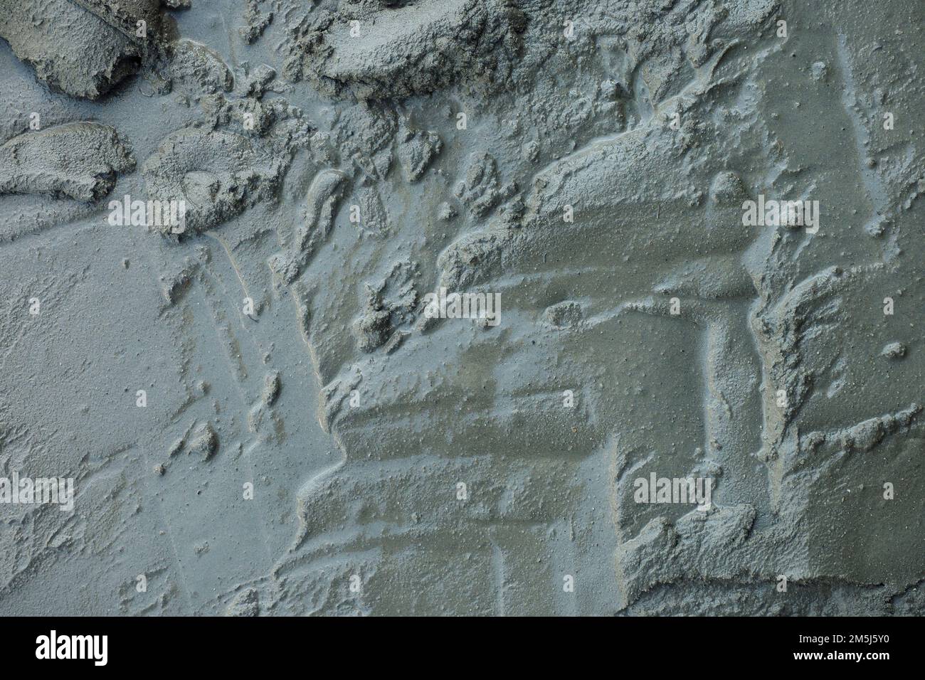 Liquid cement solution. View from top. Close-up building material ...