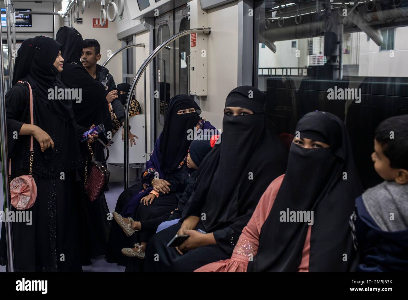 Passengers travel inside a Dhaka Metro train from Uttara North to Agargaon. Prime Minister ...