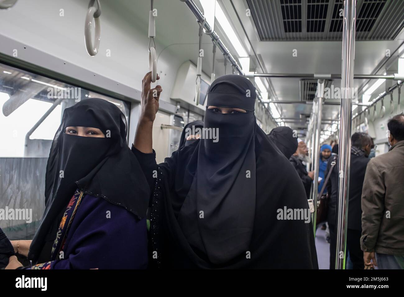 Dhaka, Bangladesh. 29th Dec, 2022. Passengers travel inside a Dhaka ...