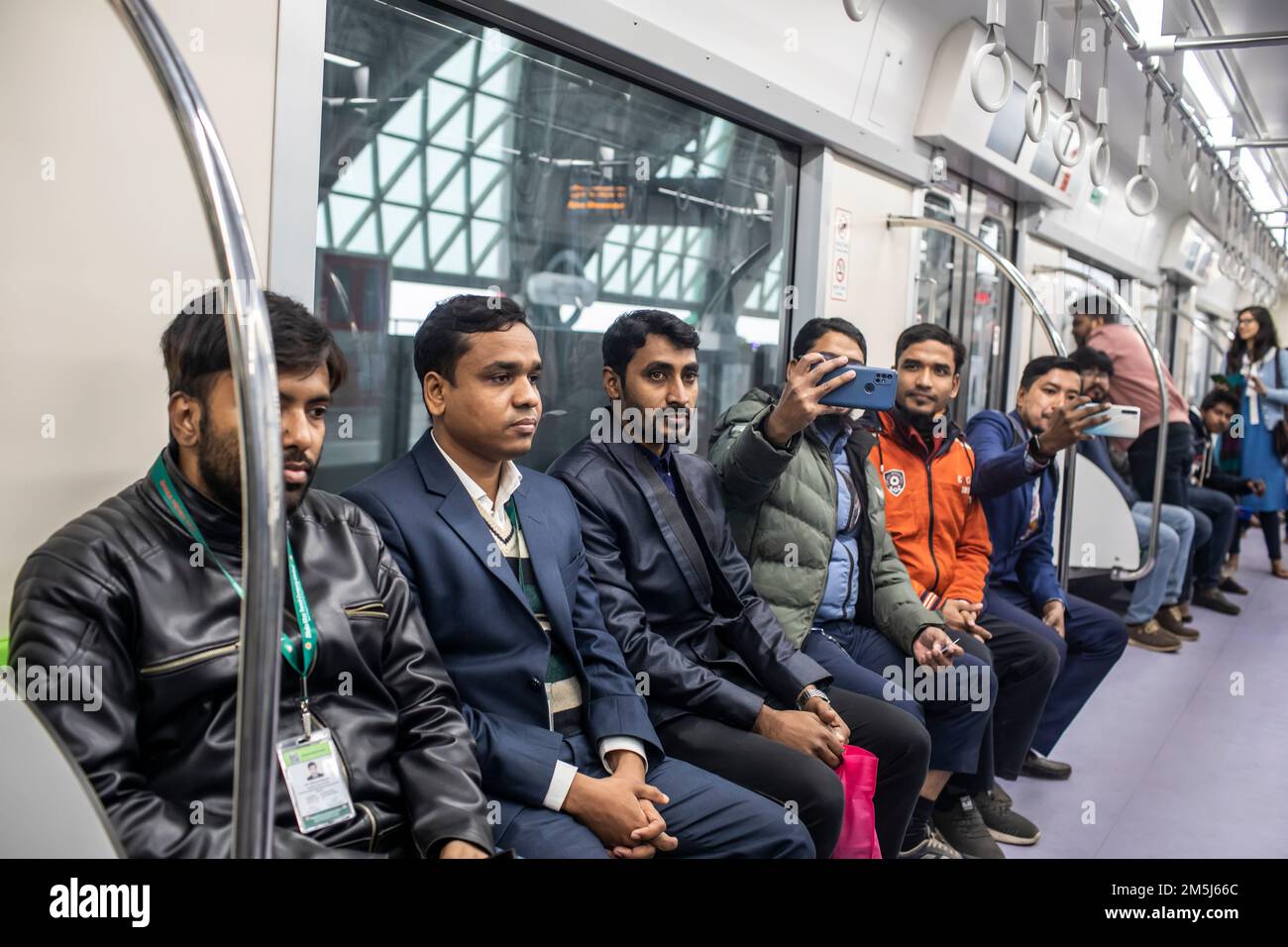 Dhaka, Bangladesh. 29th Dec, 2022. Passengers travel inside a Dhaka ...