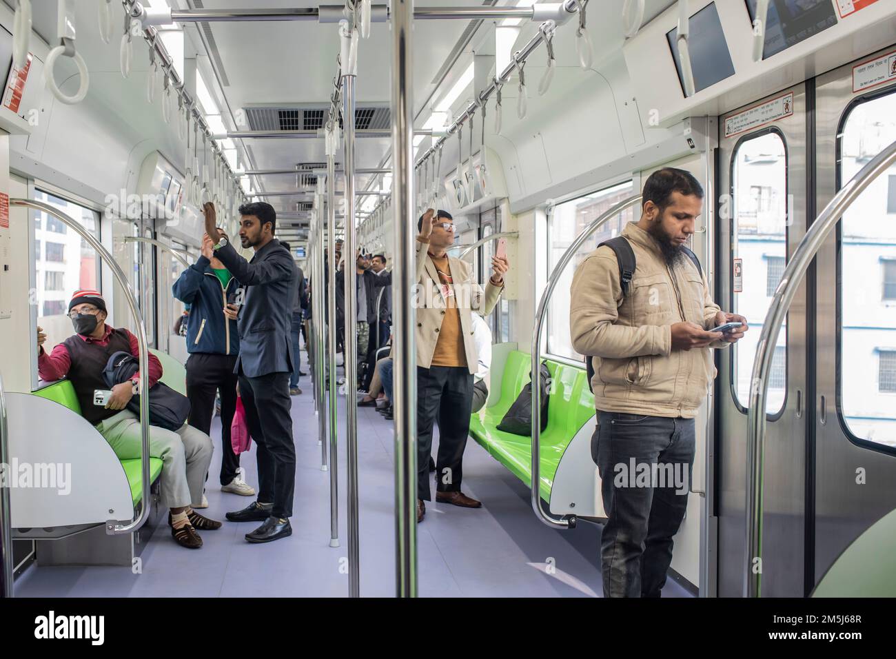 Dhaka, Bangladesh. 29th Dec, 2022. Passengers travel inside a Dhaka Metro train from Uttara ...