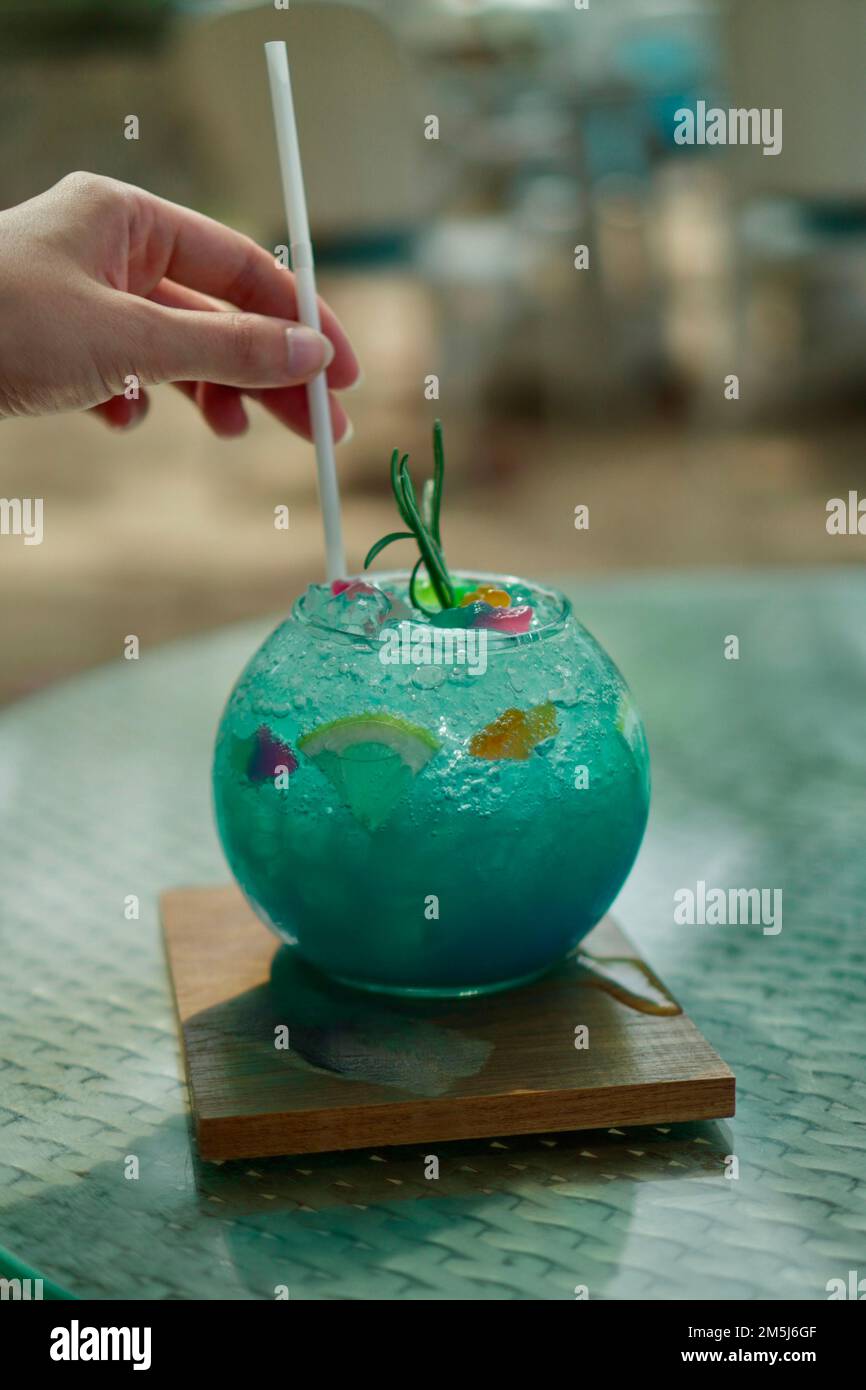 Fish Bowl Cocktail at the Beach Stock Photo - Alamy
