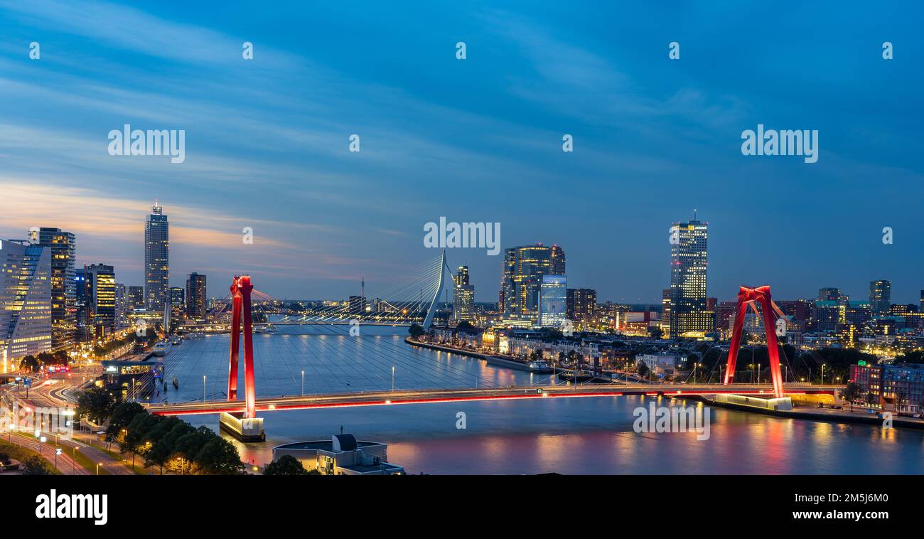 The skyline of Rotterdam at night over the river Maas showing the ...