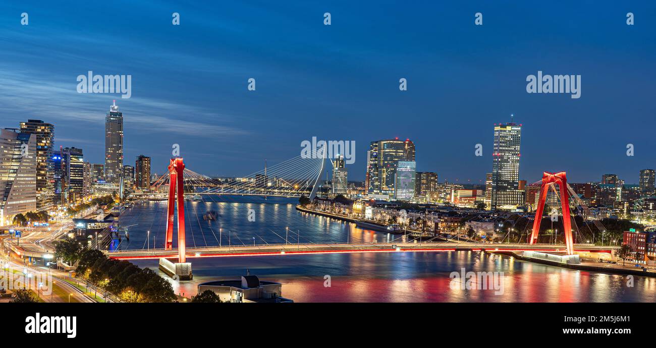 The skyline of Rotterdam at night over the river Maas showing the ...