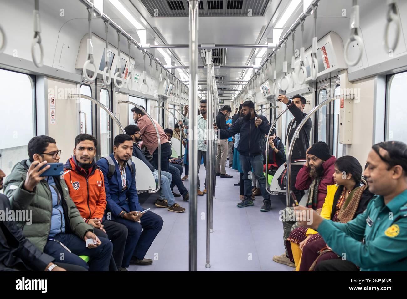 Dhaka, Bangladesh. 29th Dec, 2022. Passengers travel inside a Dhaka ...