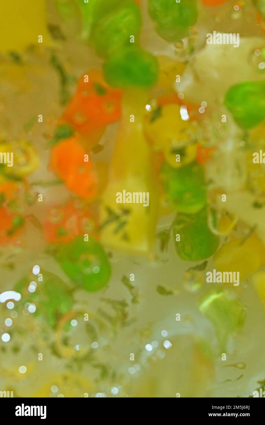 Boiling water with fresh vegetables, close-up. Close-up view of the ...