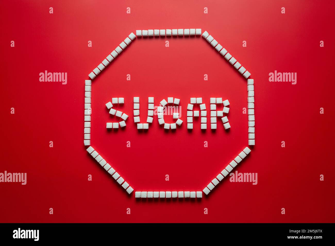 octagonal frame in the form of a stop sign made of sugar cubes with red ...