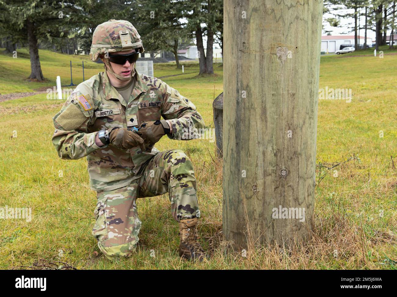 Oregon Army National Guard Soldier prepares to throw a training grenade toward a series of ...