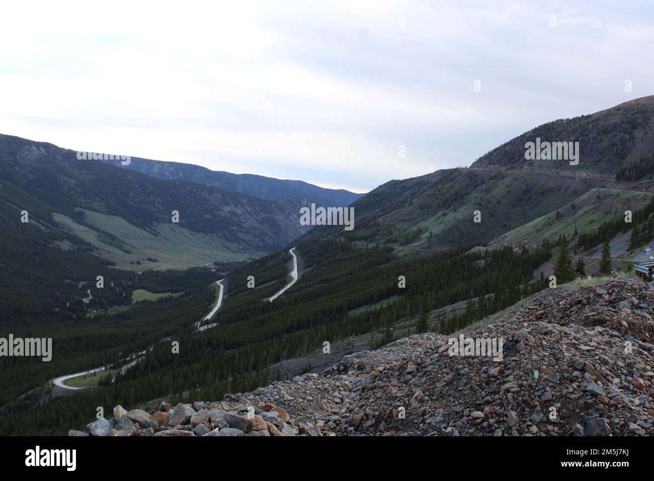 A highway through an extensive Mountain Range in Montana Stock Photo ...