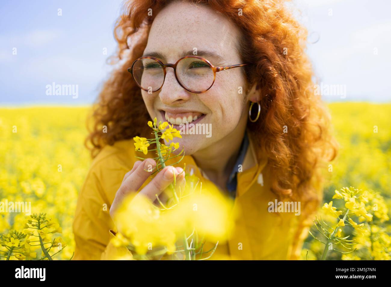 Happy woman smelling bouquet hi-res stock photography and images - Alamy