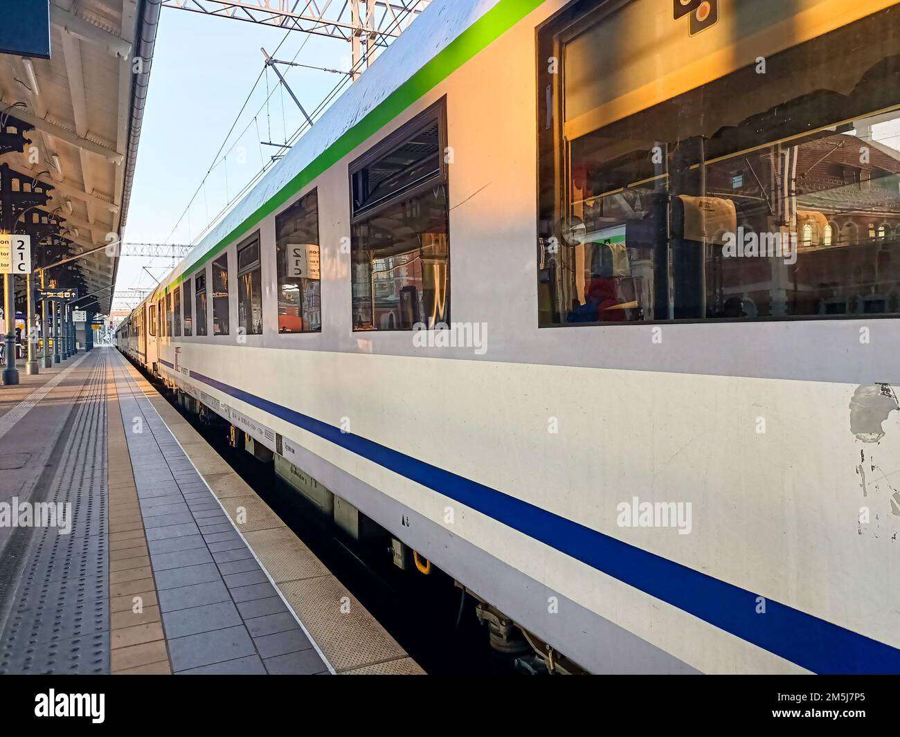 A train standing on the platform early in the morning Stock Photo - Alamy