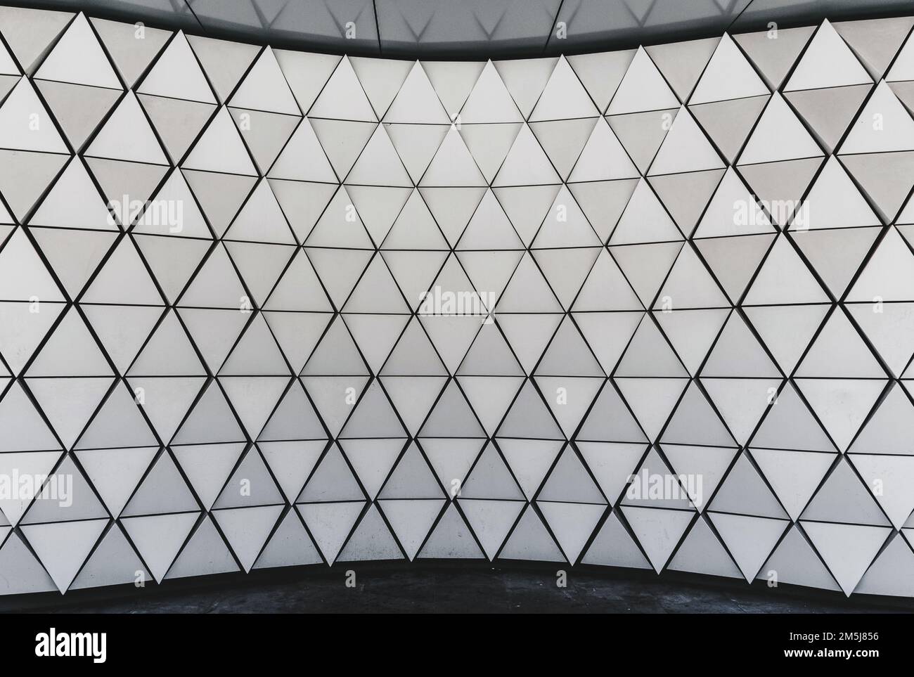 An abstract modern wall design with a black and white diamond pattern ...