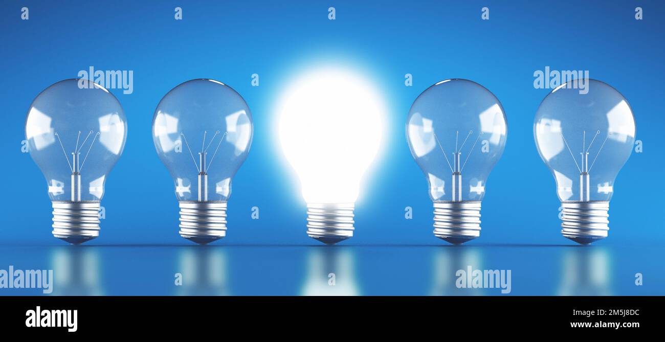 Idea concept with light bulbs sequence on a glass table with a lighted ...