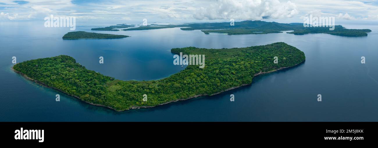 Lush, tropical islands are fringed by diverse coral reefs in the ...