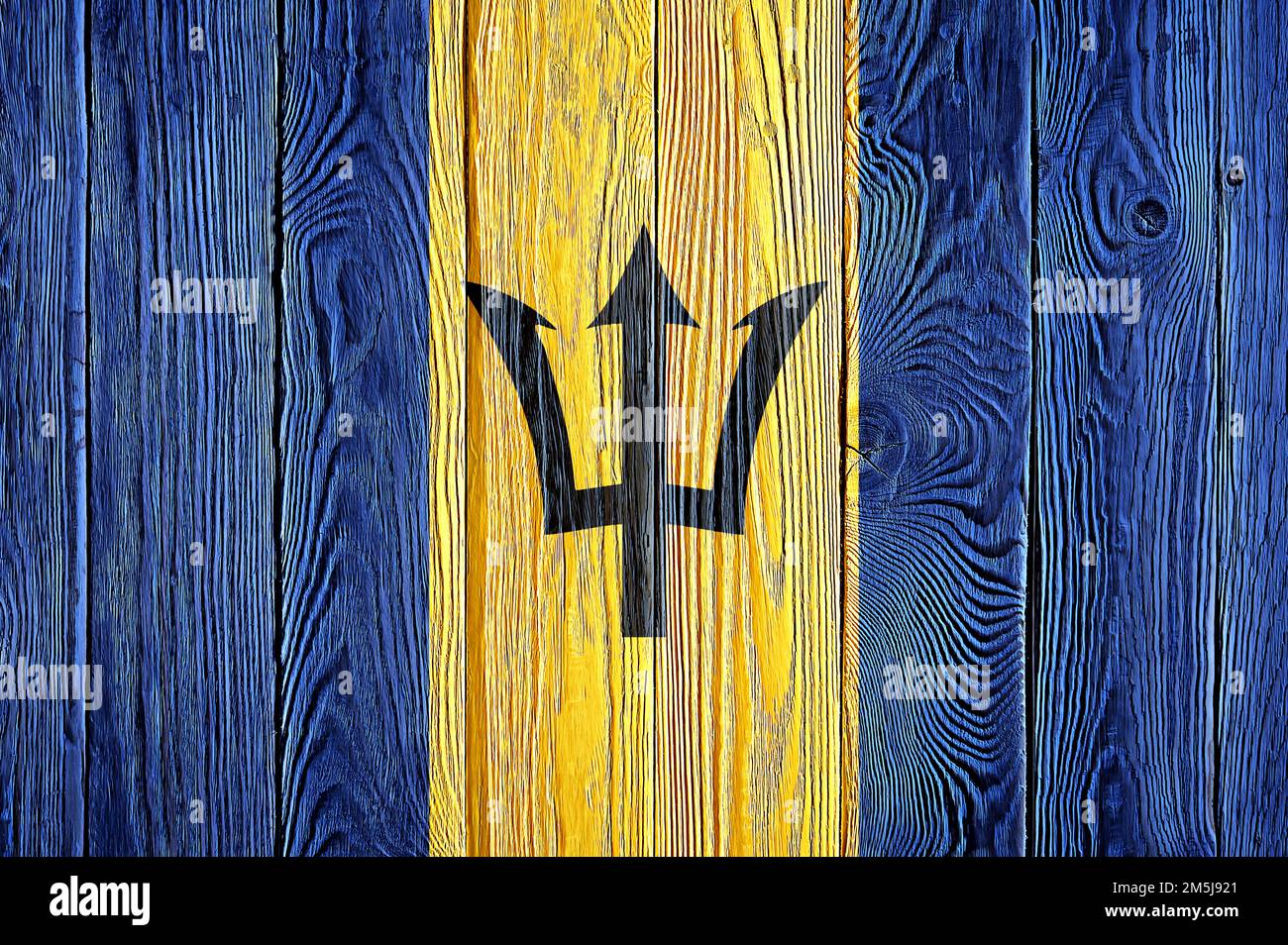 Barbados flag painted on old wood plank background. Brushed natural ...