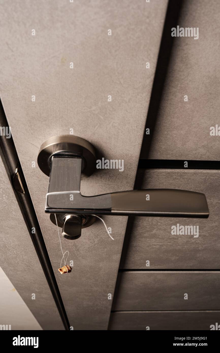 Real human teeth hanging on the door handle. Pulled out tooth ...