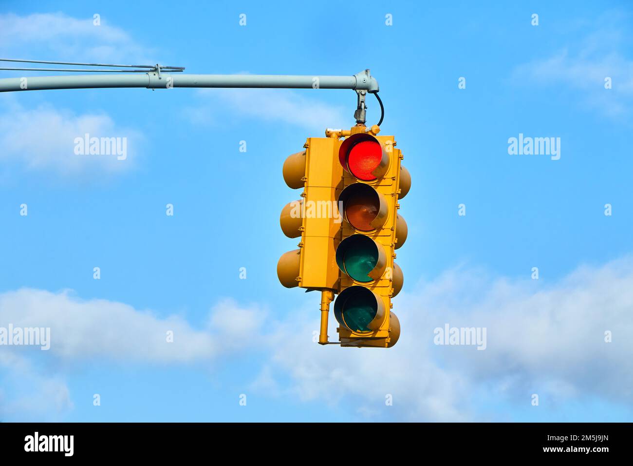 Brooklyn, NY, USA, 12.24.22: close up of a yellow street traffic light ...