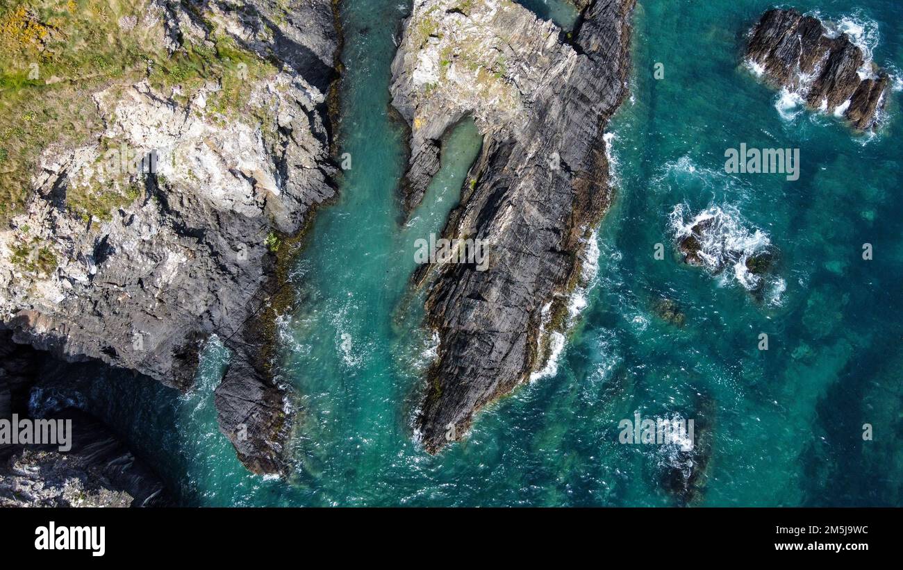 Turquoise waters of the Atlantic Ocean and large coastal cliffs ...