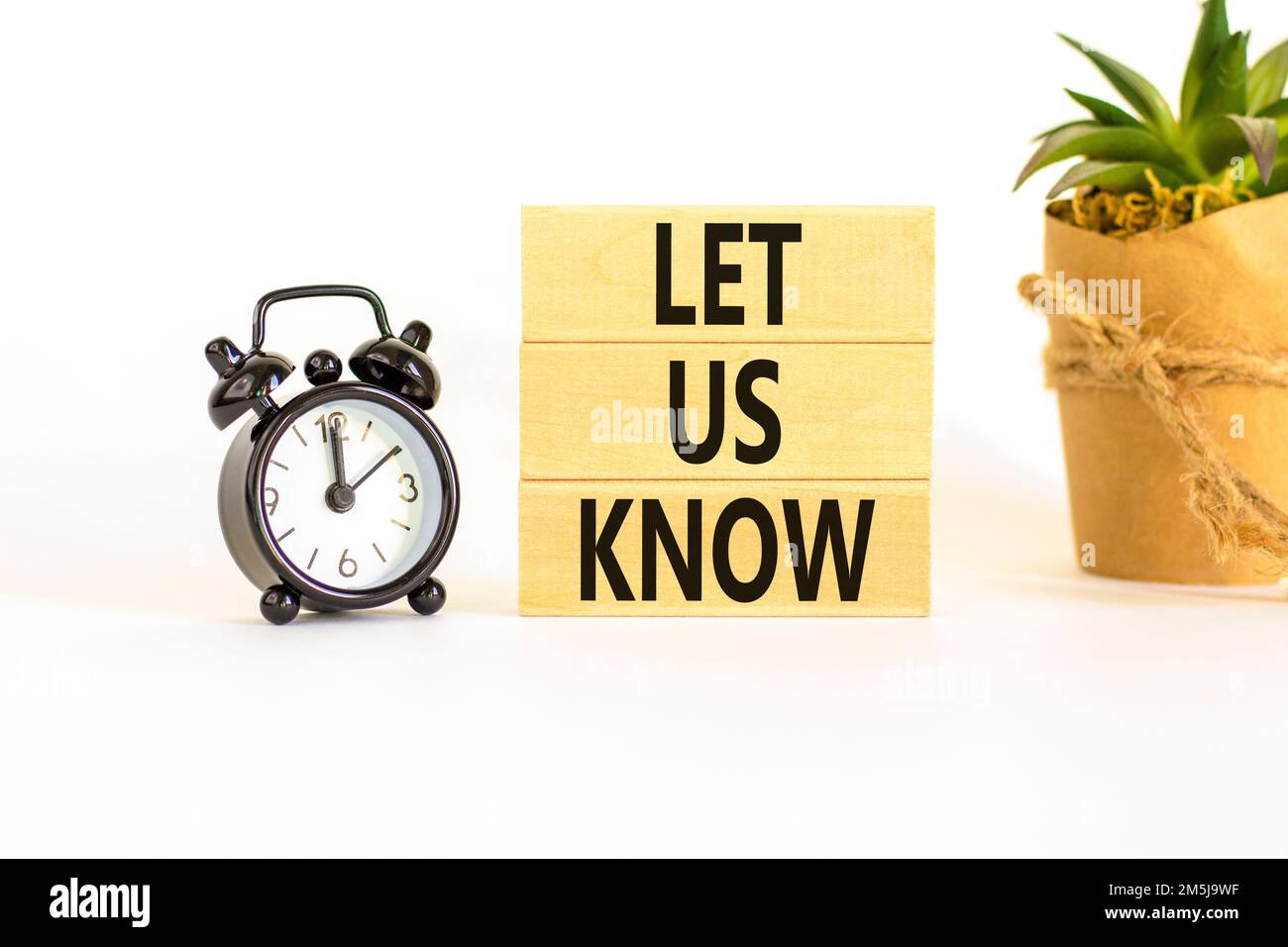 Let us know symbol. Concept words Let us know on wooden blocks on a ...