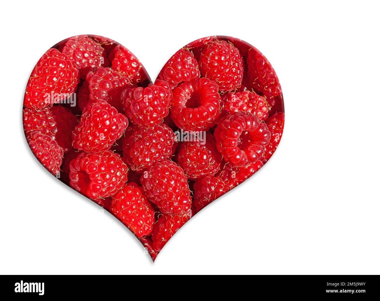 Raspberries against white background, heart shaped Stock Photo - Alamy