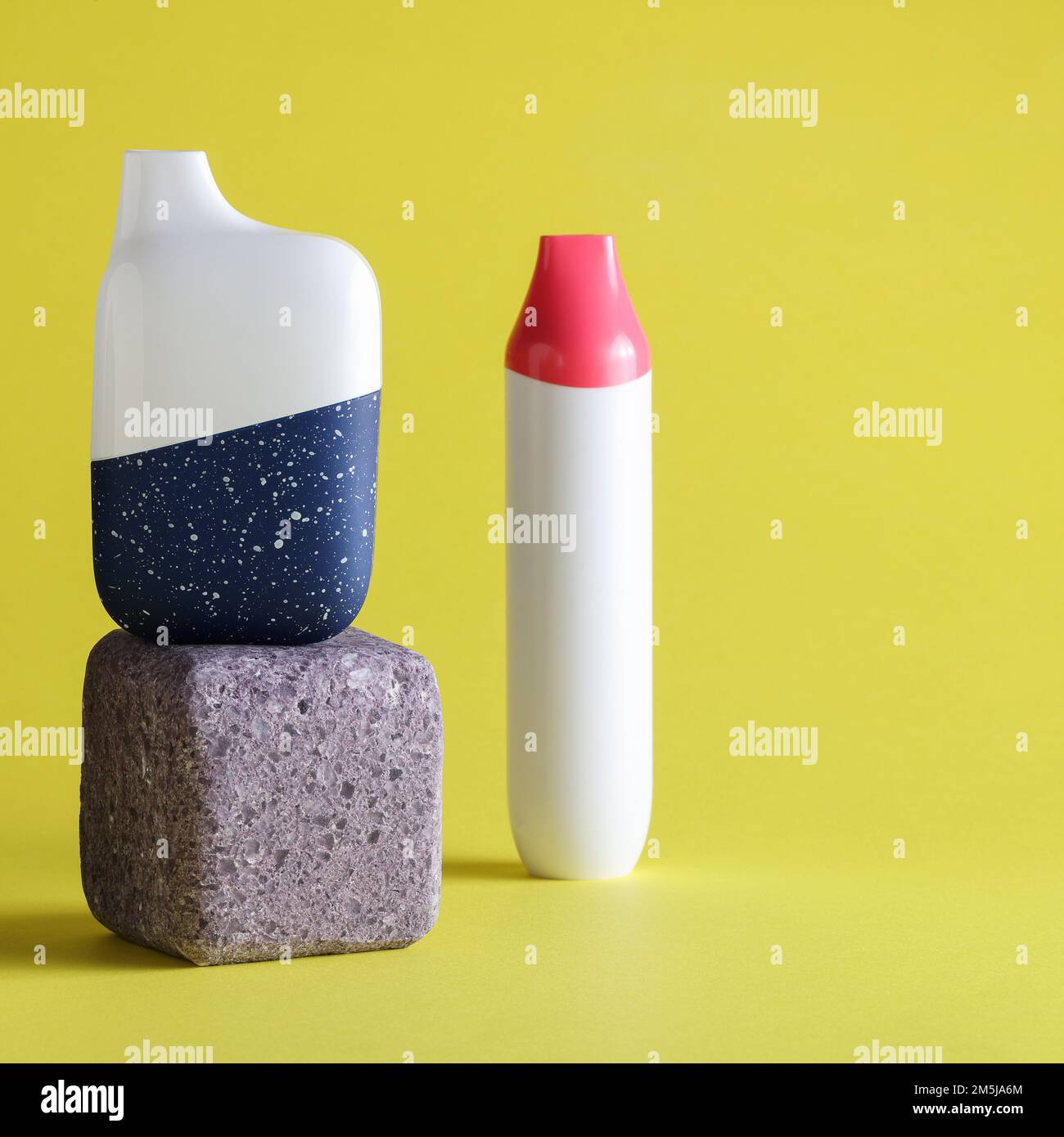 disposable electronic cigarettes or vapes on yellow background. copy ...