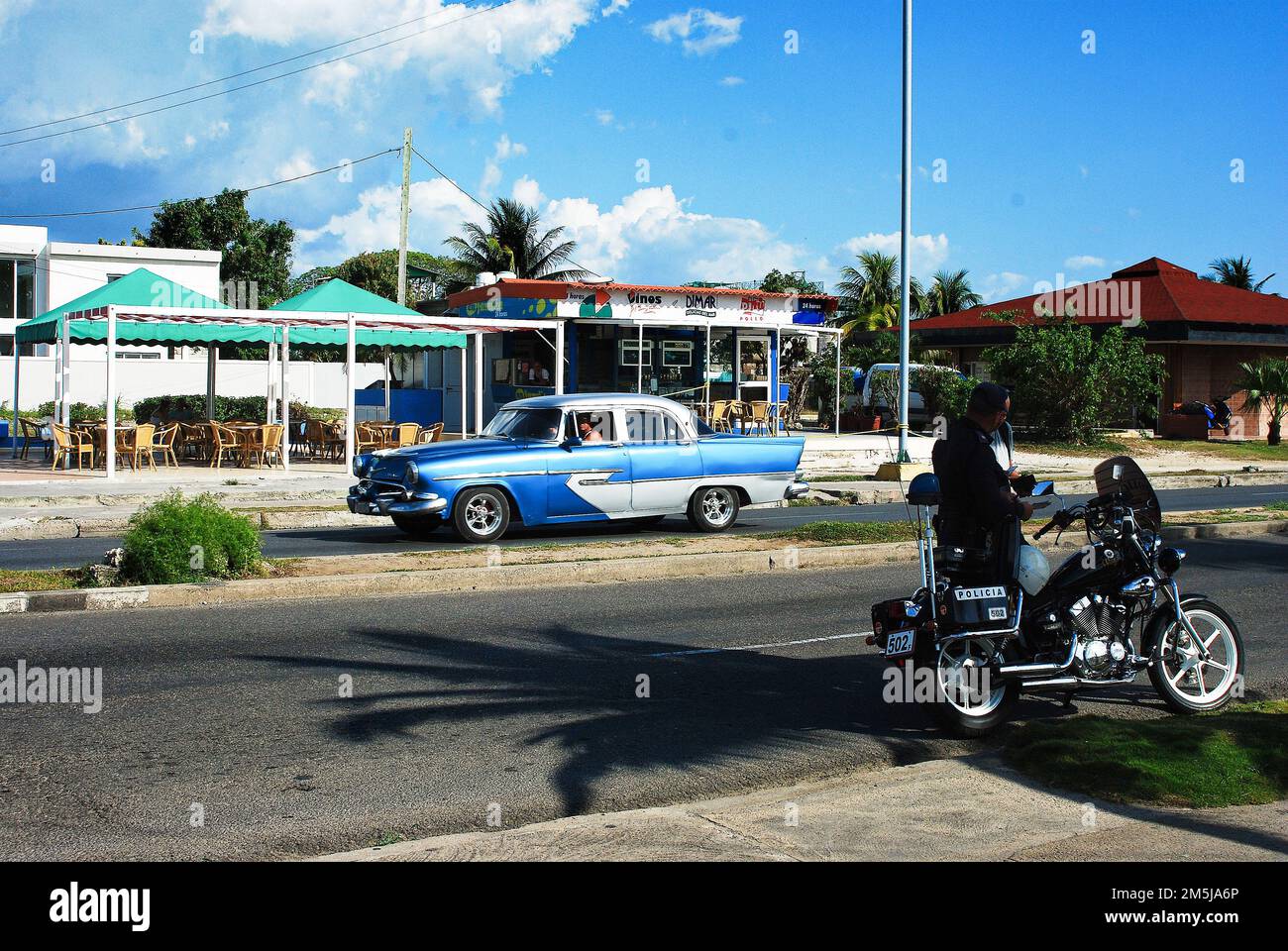 Old american cars in cuban streets with the police in the Stock Photo ...