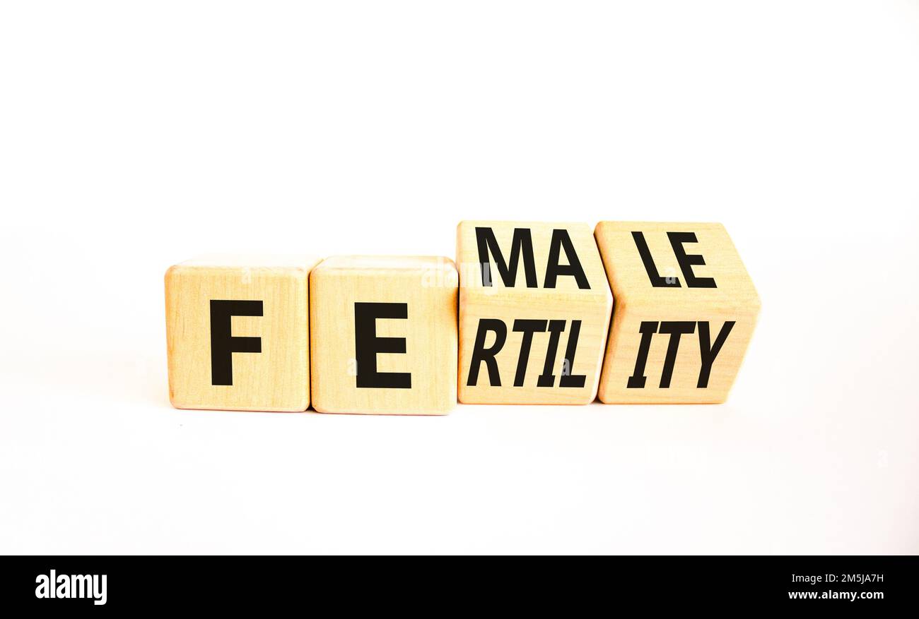 Female fertility symbol. Concept word Female fertility on wooden cubes ...